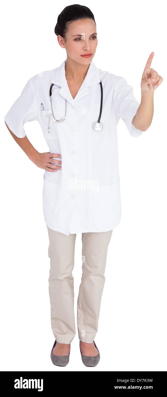 Pretty brown haired nurse pointing Stock Photo - Alamy