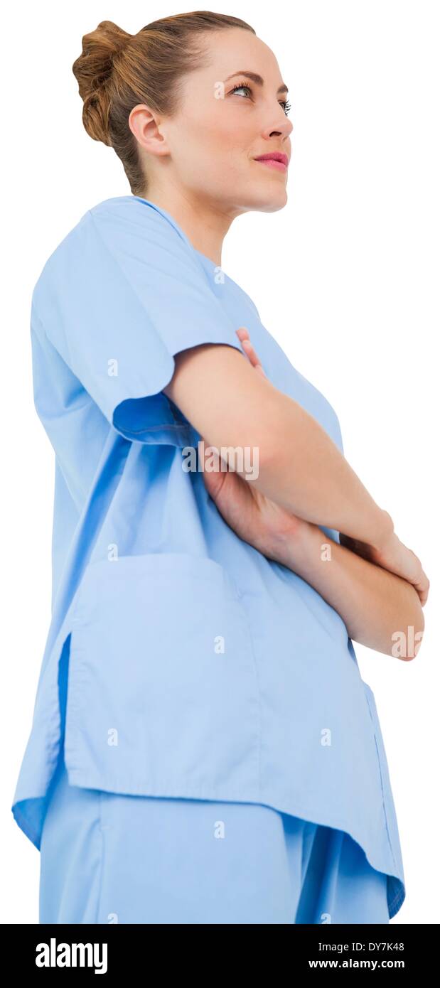Pretty surgeon in blue scrubs with arms crossed Stock Photo - Alamy