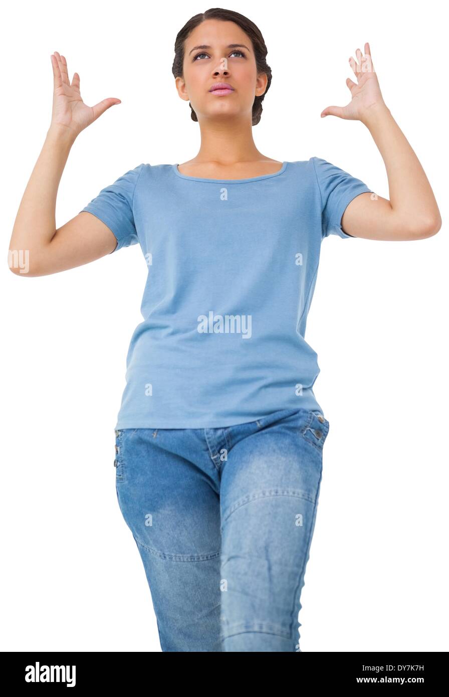 Annoyed pretty young brunette gesturing on white background Stock Photo ...