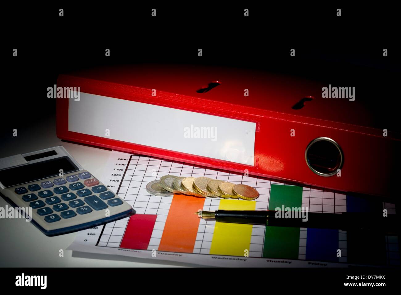Red business binder on a desk Stock Photo - Alamy