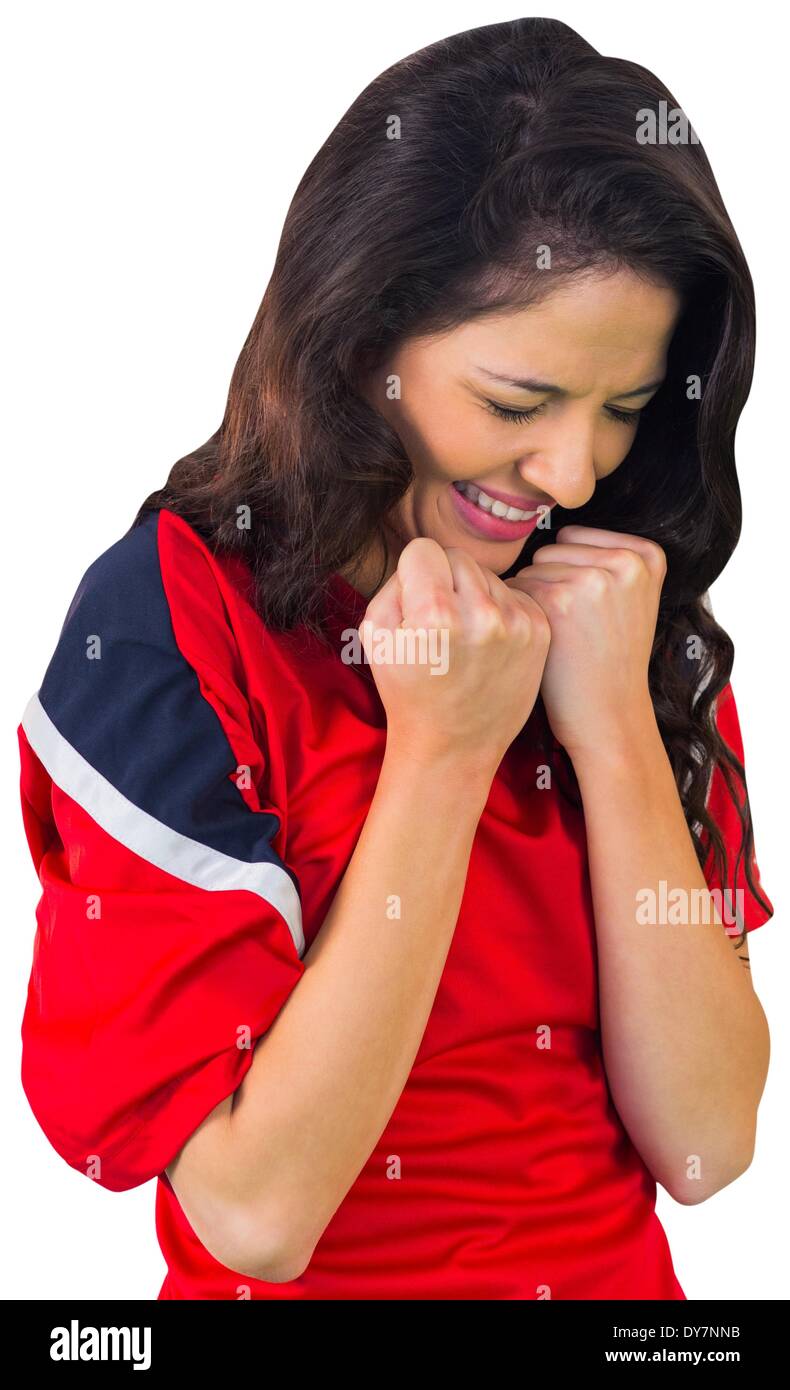 Cheering football fan in red on white background Stock Photo - Alamy