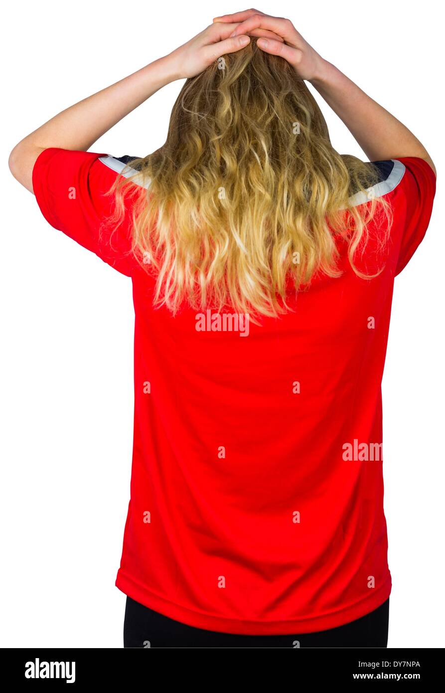 Disappointed football fan in red on white background Stock Photo - Alamy