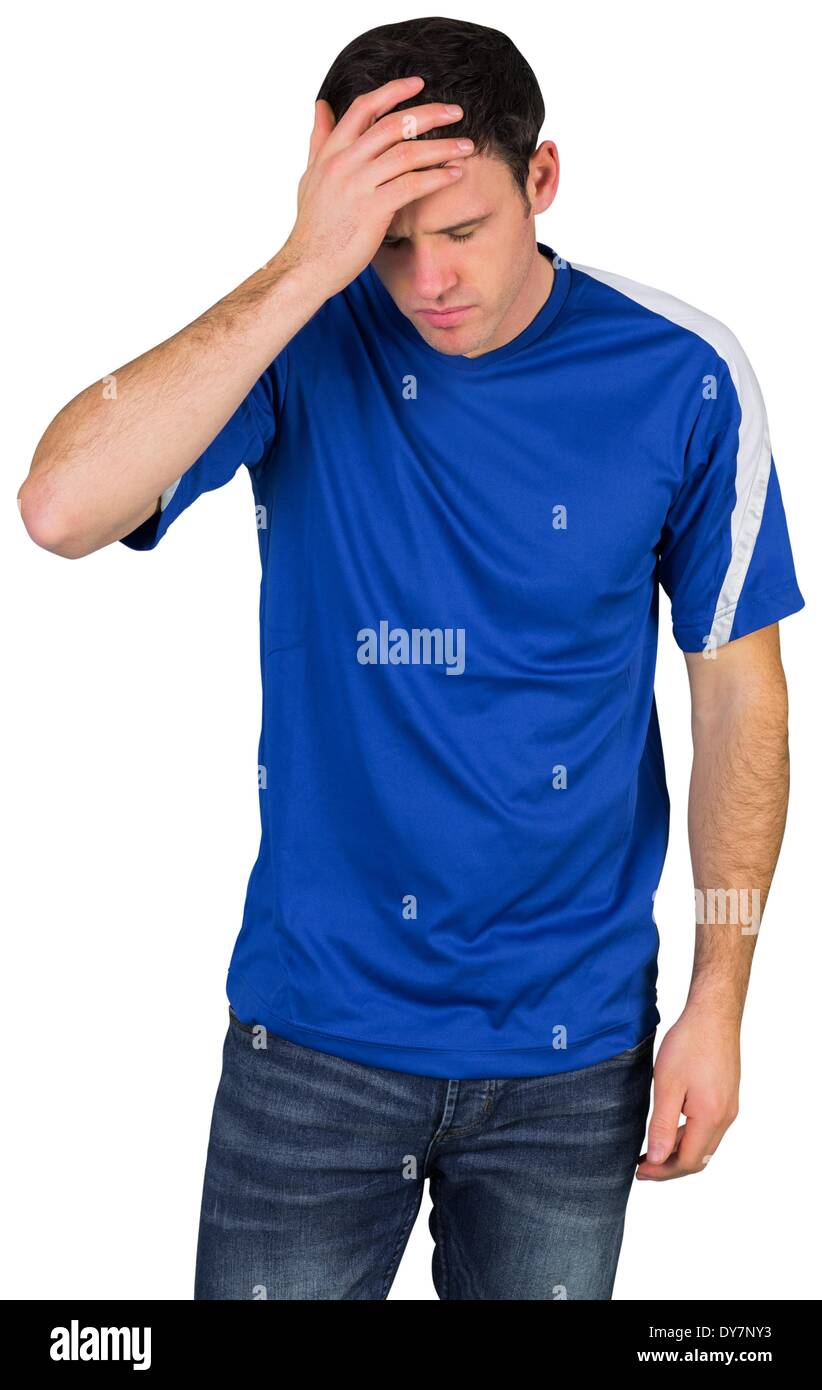 Disappointed football fan in blue on white background Stock Photo - Alamy