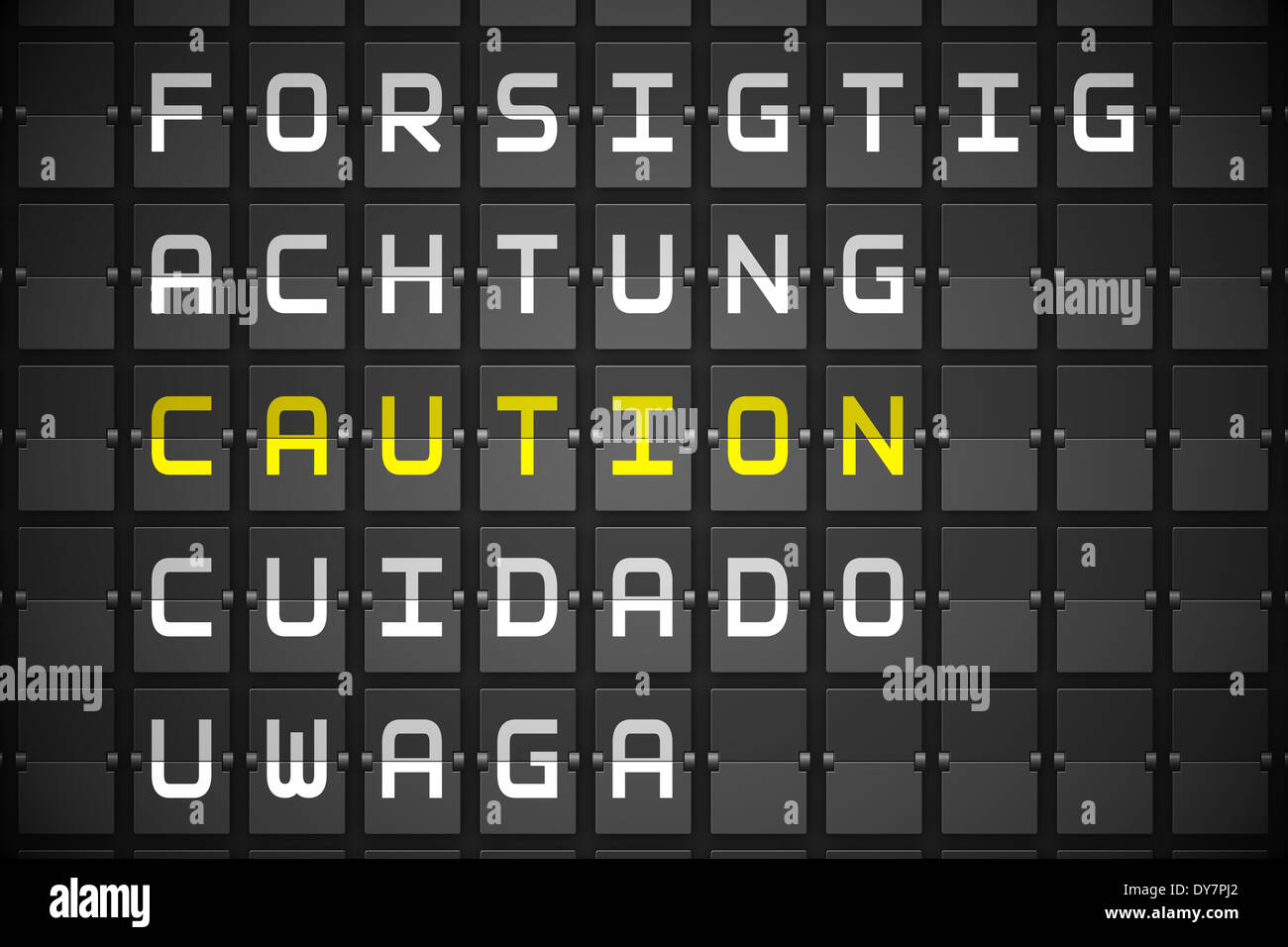 Caution in languages on black mechanical board Stock Photo - Alamy