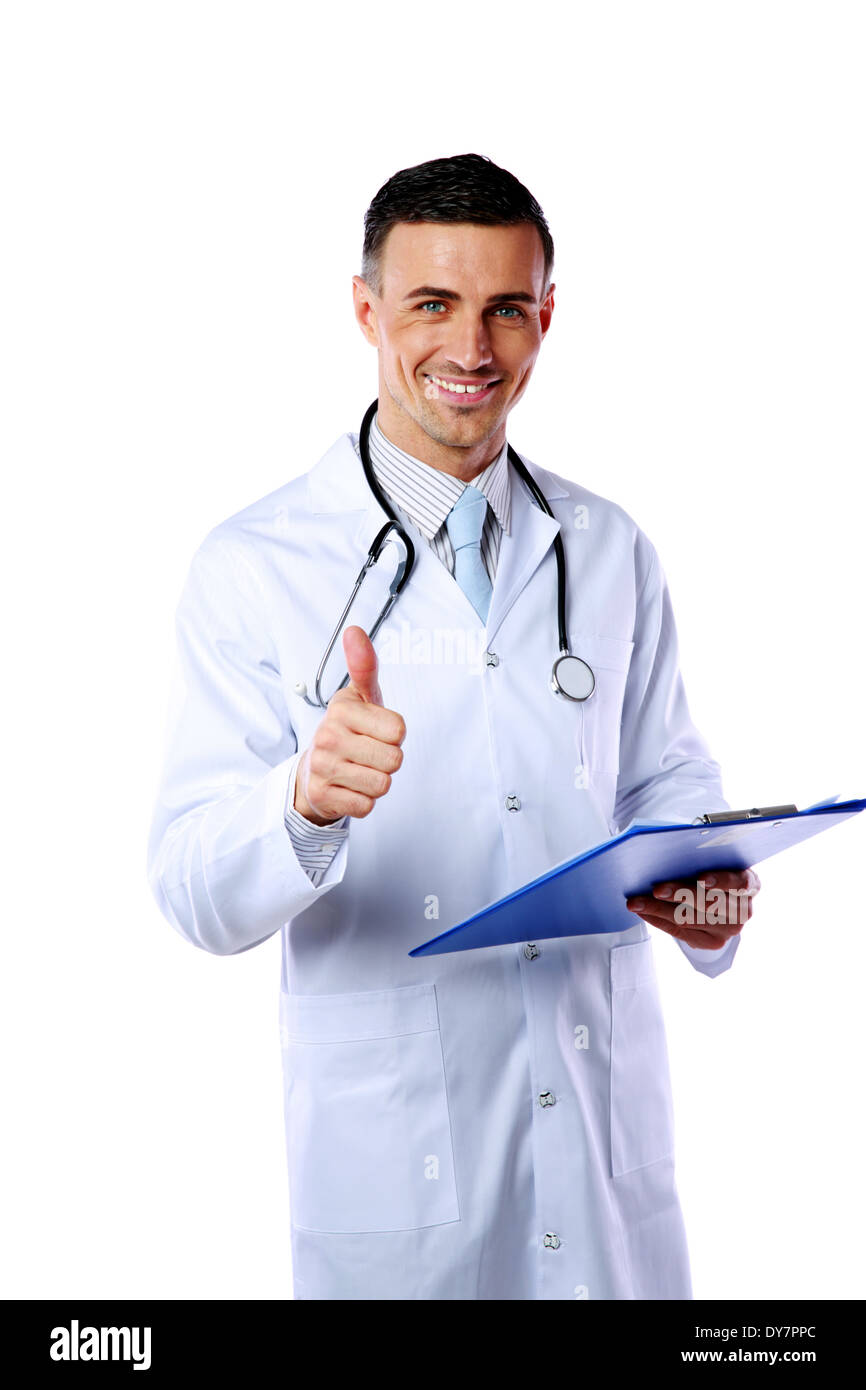 Happy male doctor standing and giving thumb up over white background ...