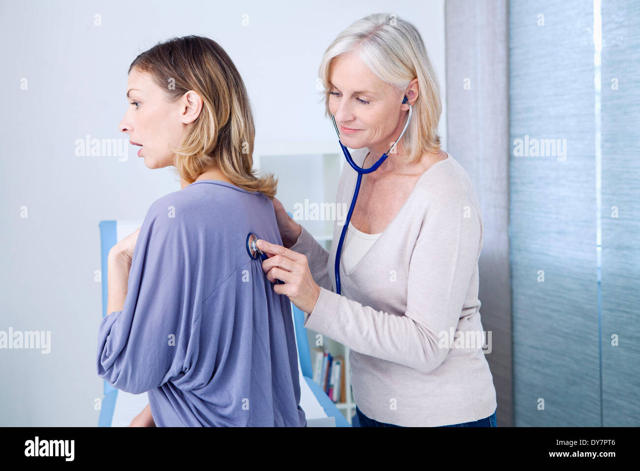 Female physical exam auscultation hi-res stock photography and images ...