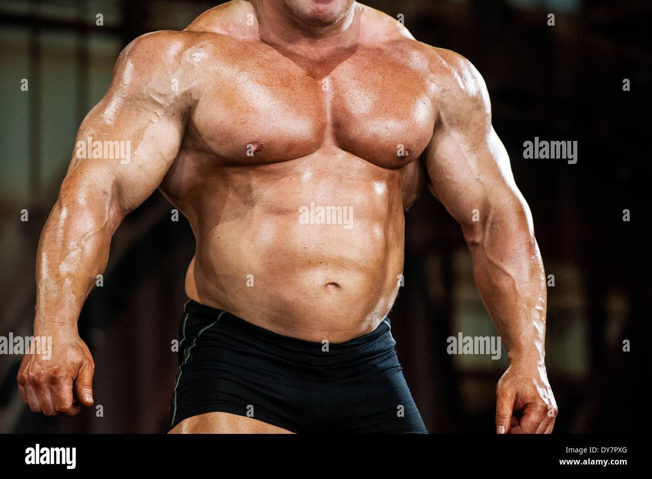 Detail of a male bodybuilder during the fitness fair FIBO in Cologne ...