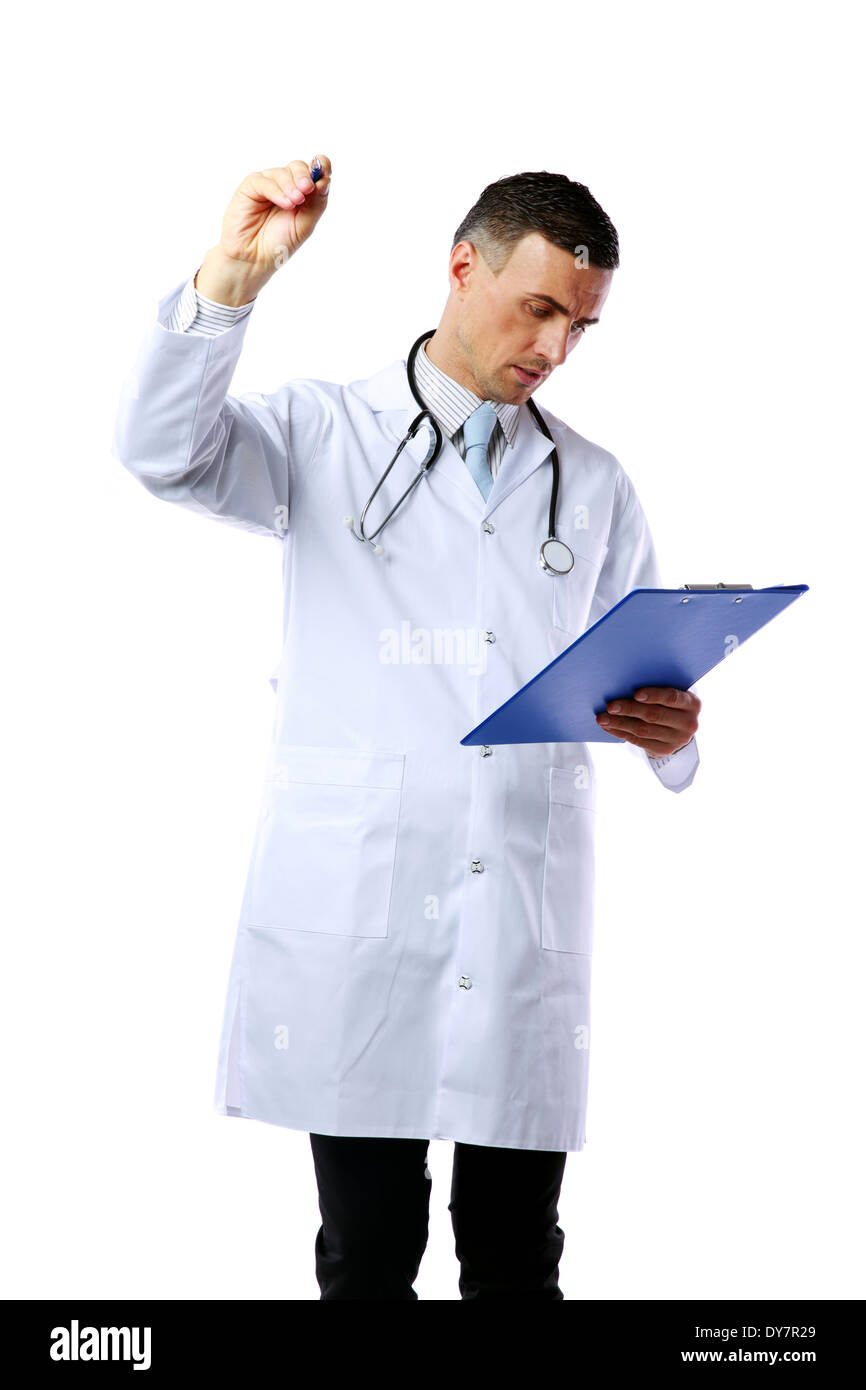 Man doctor writing with pen at copyspace and holding clipboard over ...