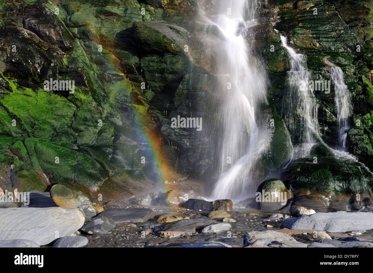 Waterfall and rainbow at Tresaith Beach, Aberporth, West Wales Stock ...