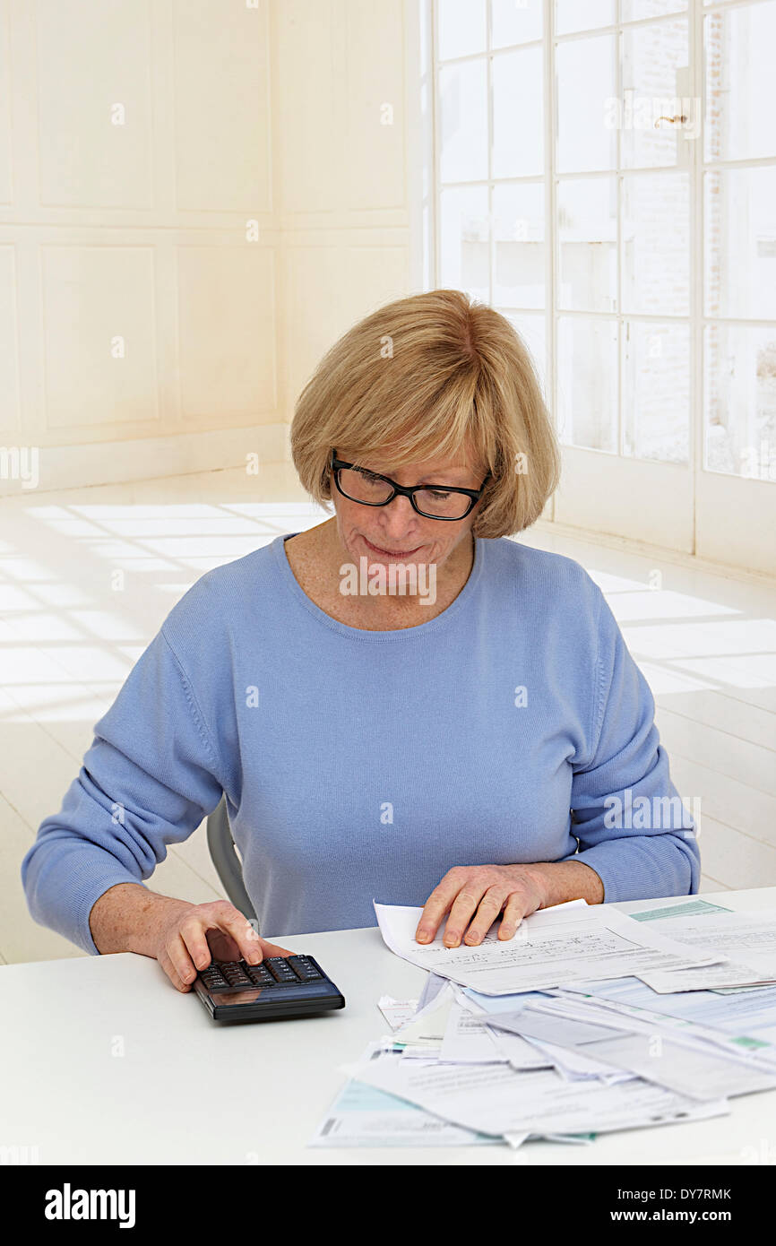 Elderly person doing paperwork Stock Photo - Alamy