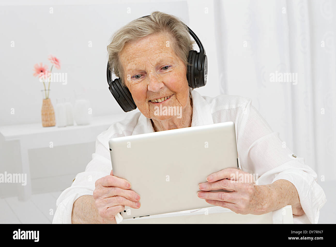 Elderly person with tablet Stock Photo - Alamy