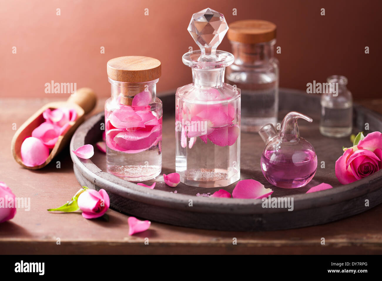 alchemy and aromatherapy set with rose flowers and flasks Stock Photo ...
