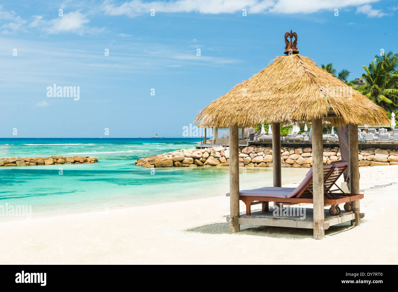 beach beds with roof and turquoise sea Stock Photo - Alamy