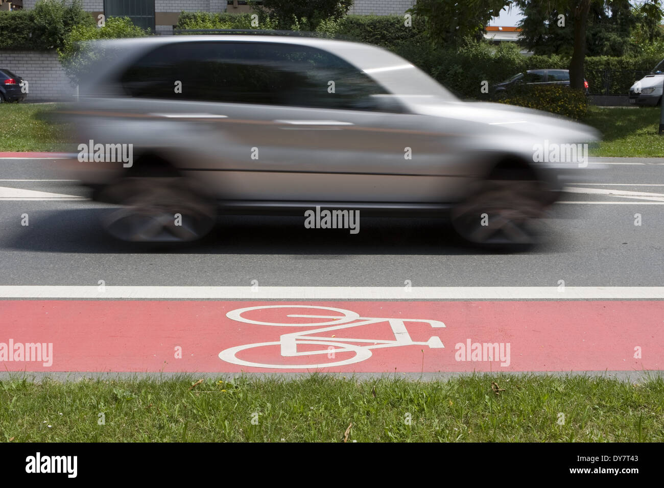 Car driving next to cycle track hi-res stock photography and images - Alamy