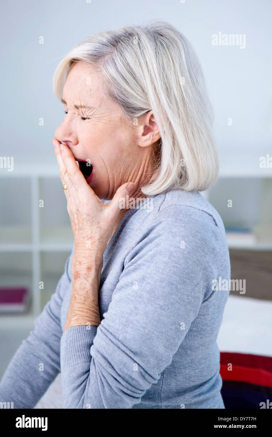 Yawning mature women hi-res stock photography and images - Alamy