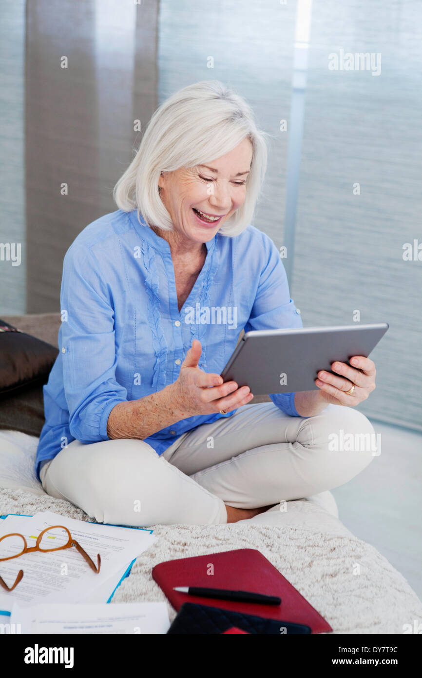 Elderly person with tablet Stock Photo - Alamy