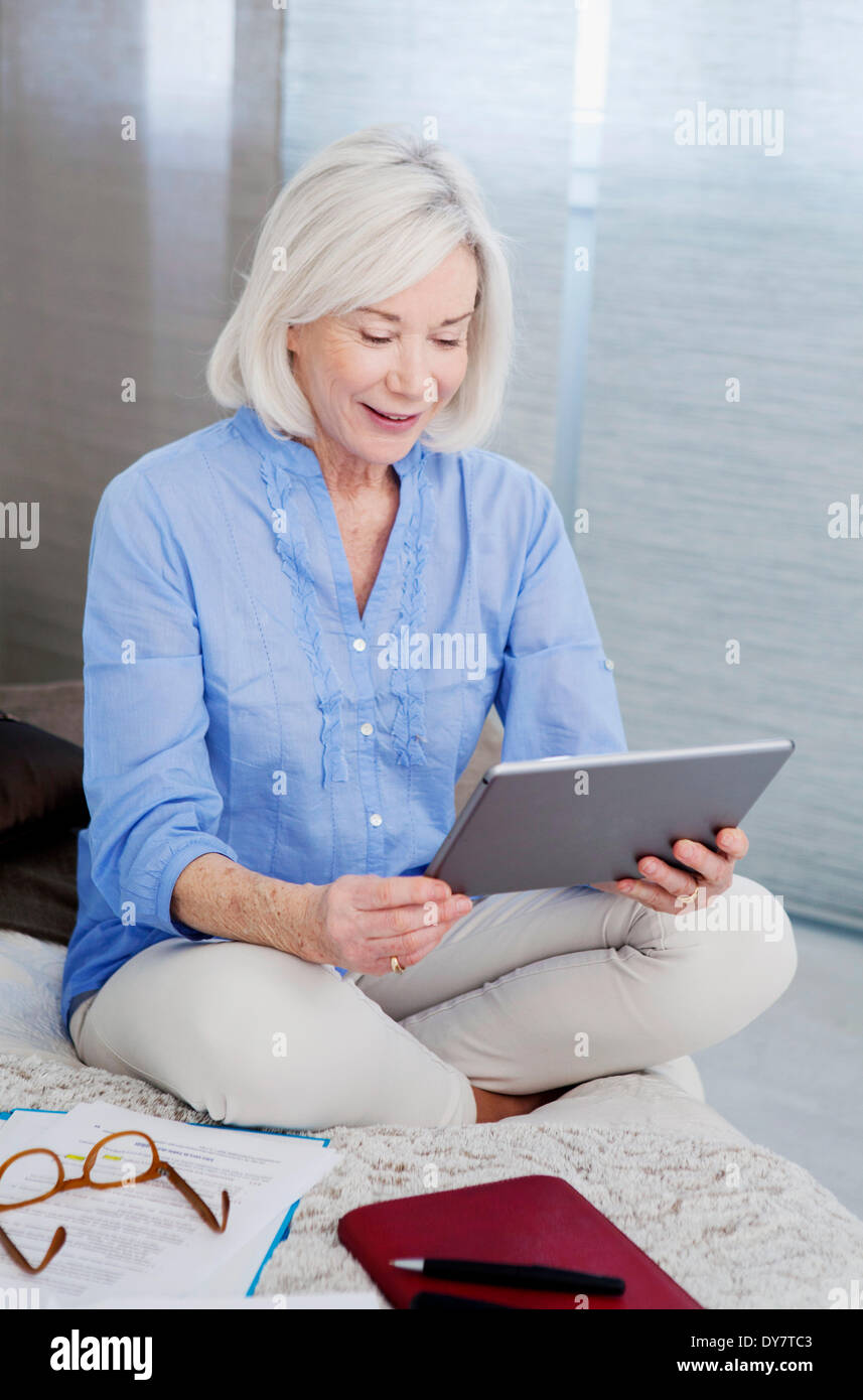 Elderly person with tablet Stock Photo - Alamy