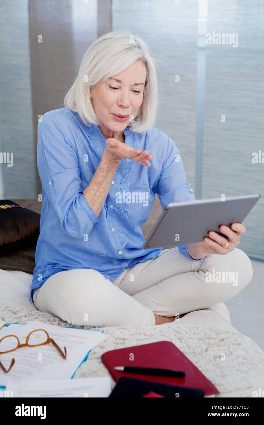 Elderly person with tablet Stock Photo - Alamy