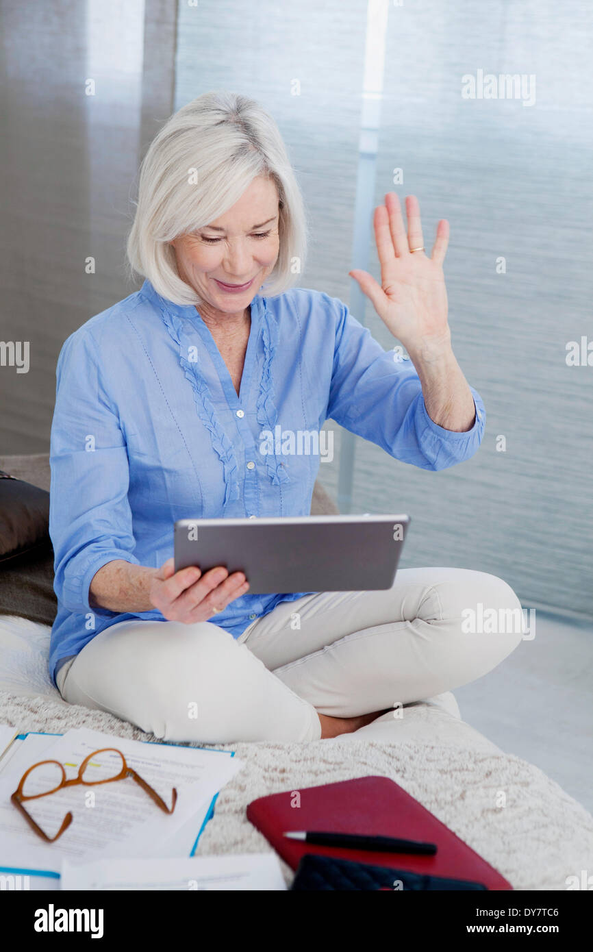 Elderly person with tablet Stock Photo - Alamy