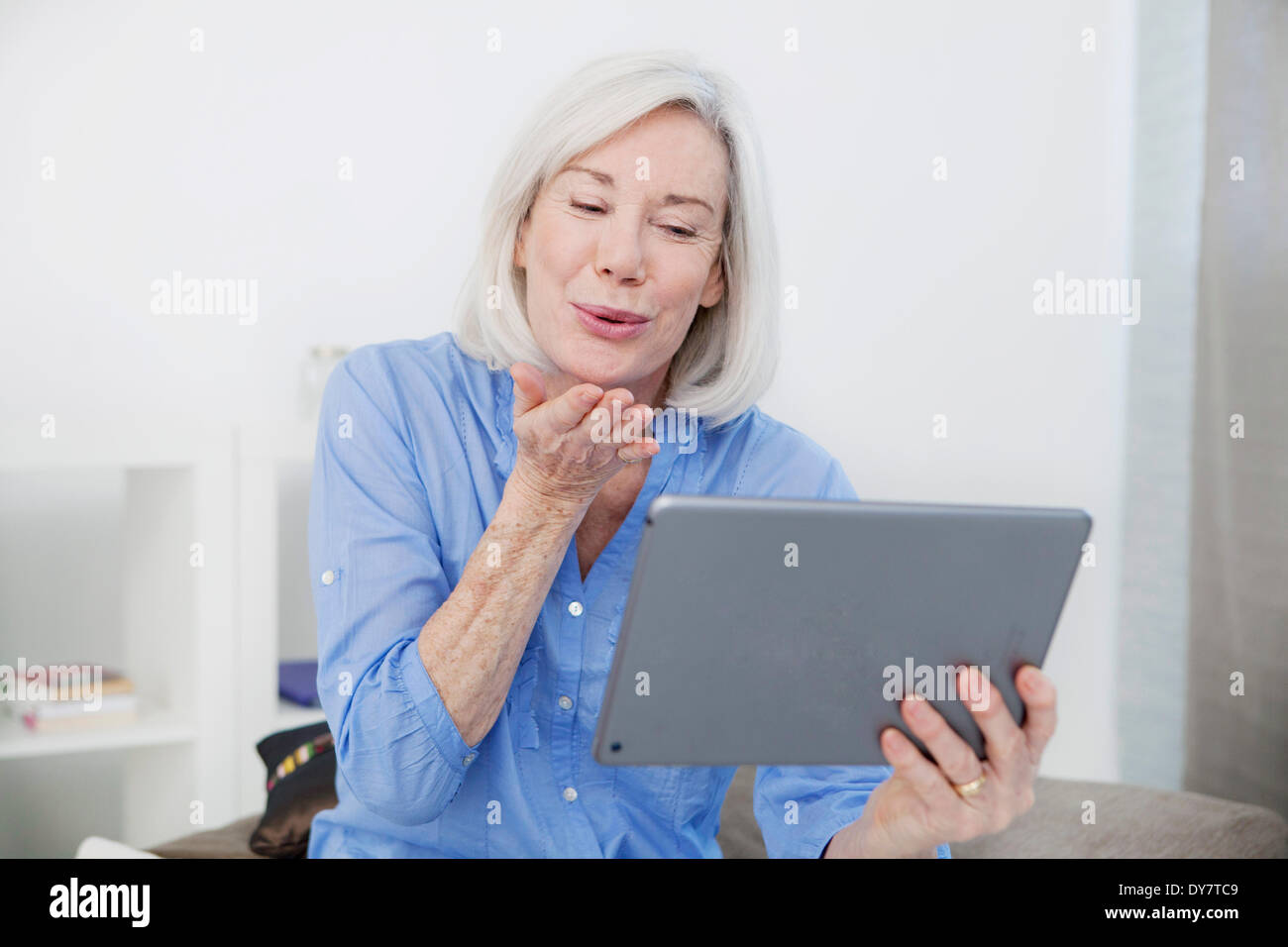 Elderly person with tablet Stock Photo - Alamy