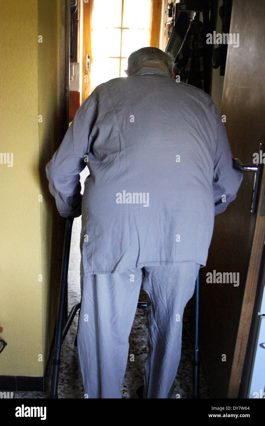 Elderly man walking zimmer frame hi-res stock photography and images ...