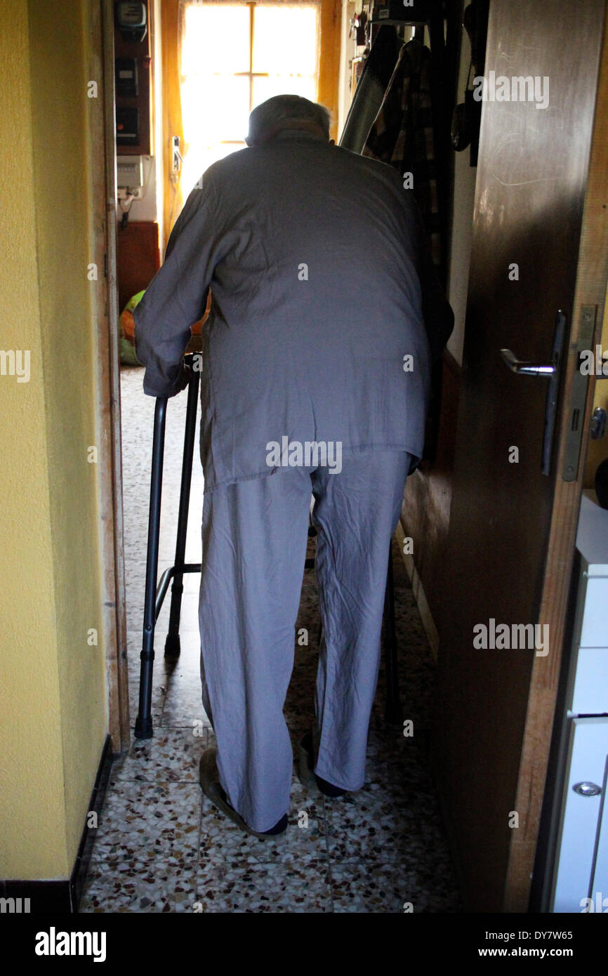 Elderly man walking zimmer frame hi-res stock photography and images ...