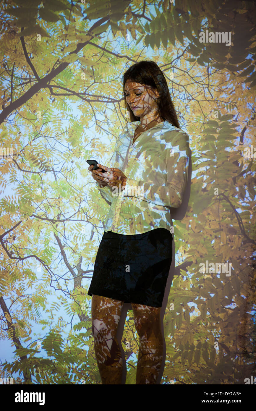 Young woman in nature projection using smart phone Stock Photo - Alamy