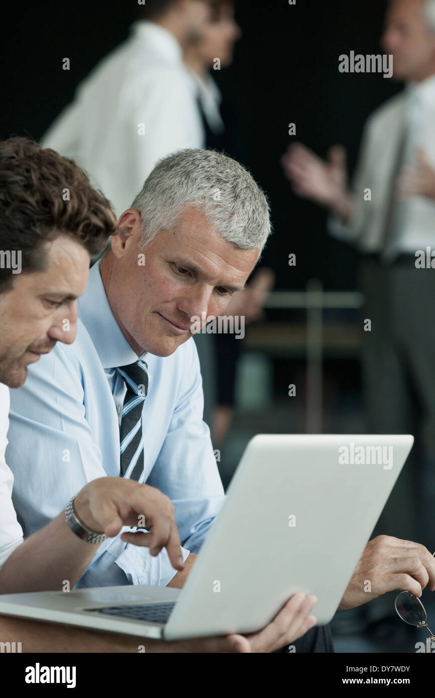 Two businessmen with laptop Stock Photo - Alamy