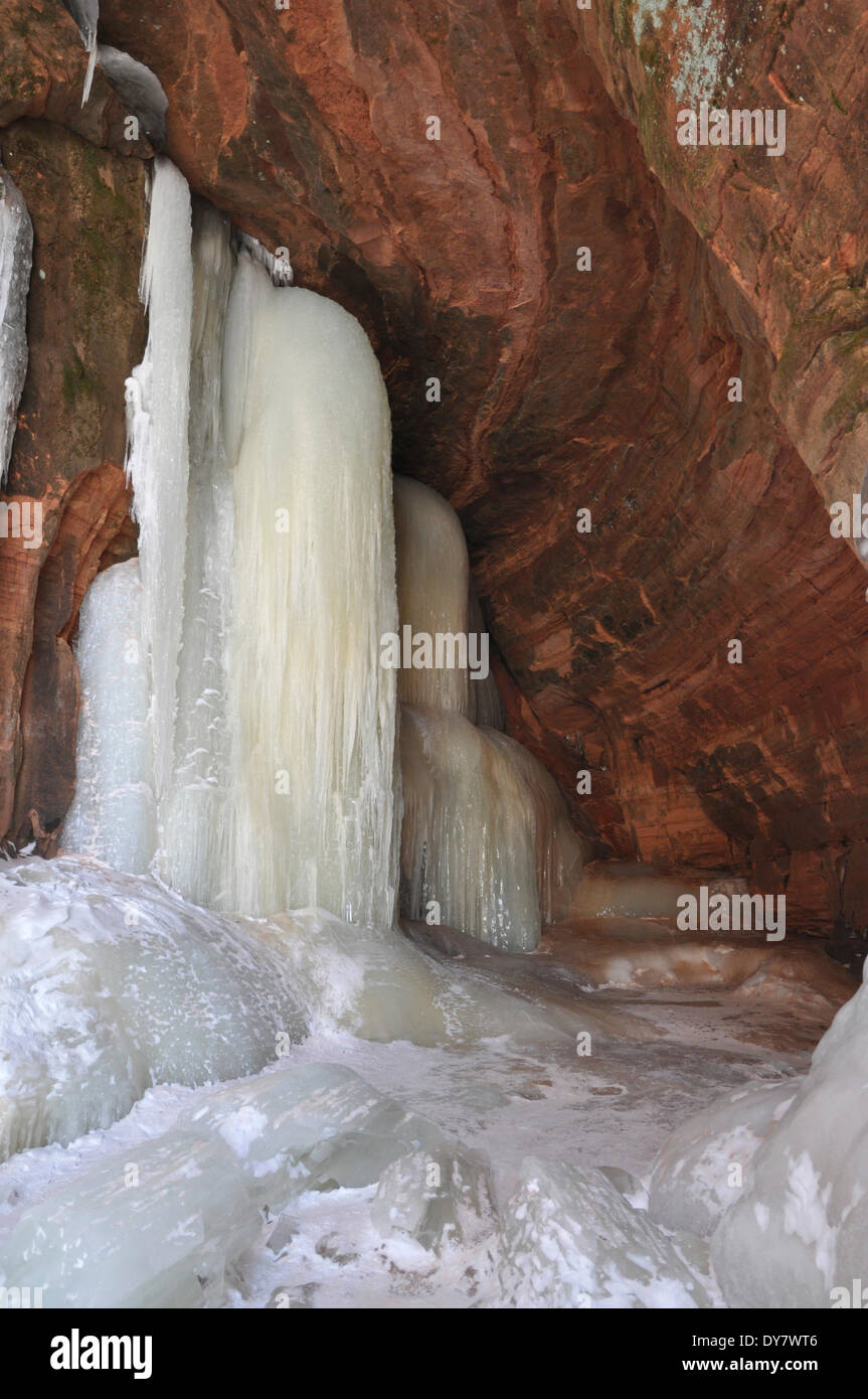 Frozen waterfall inside a cave on the shore of Lake Superior, Apostle ...
