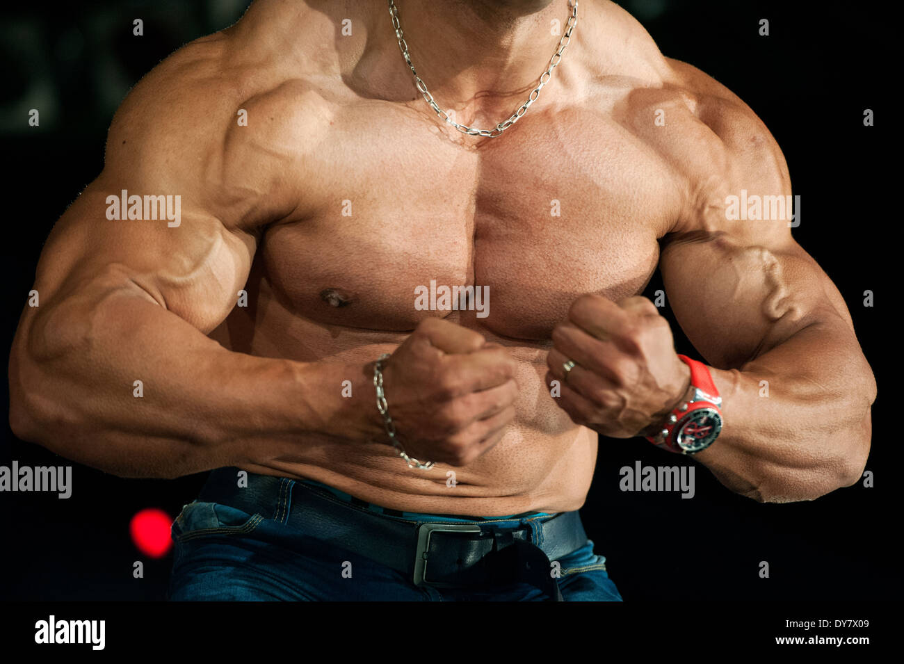 Detail of a male bodybuilder during the fitness fair FIBO in Cologne ...