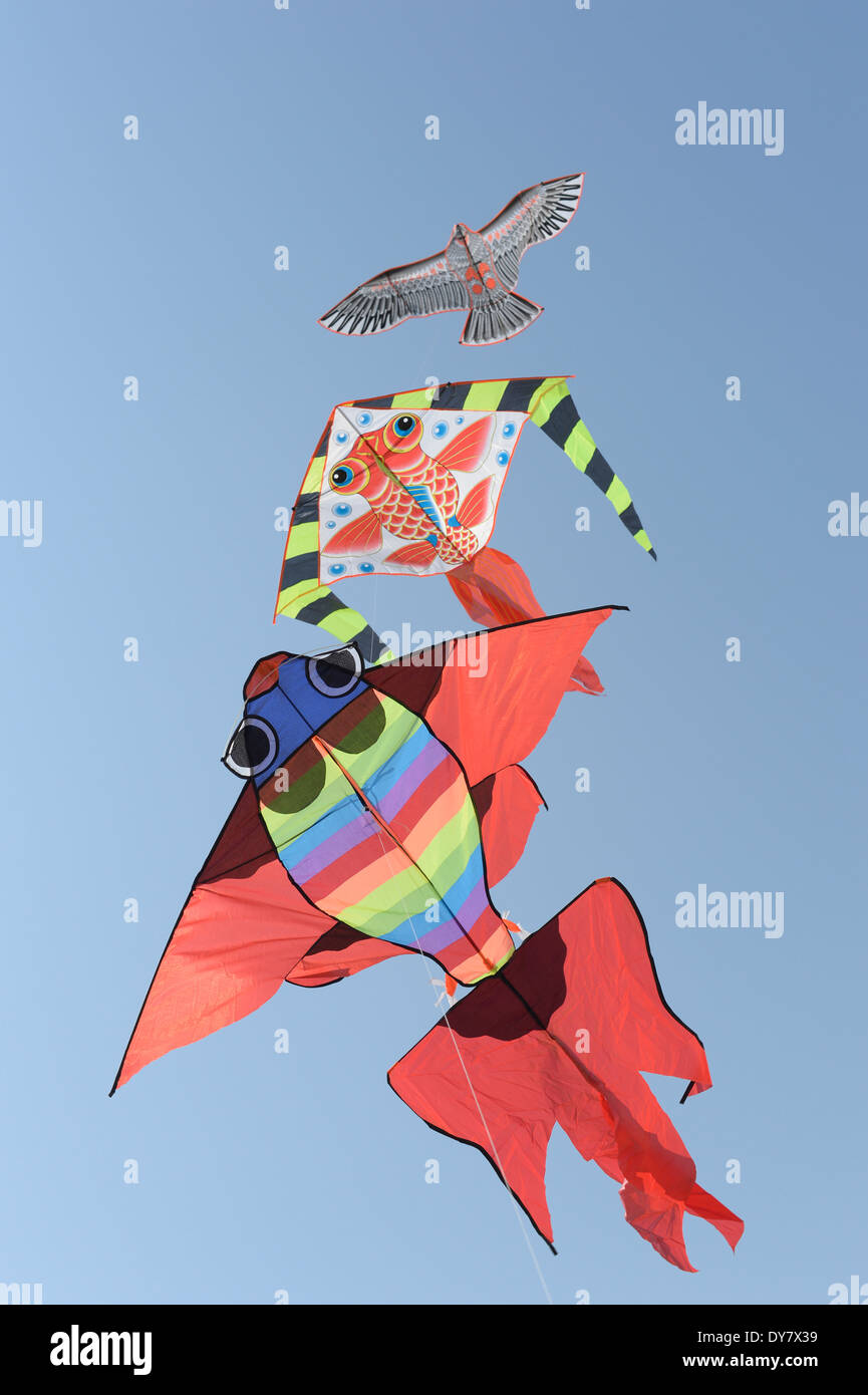 Three kites in front of blue sky Stock Photo - Alamy