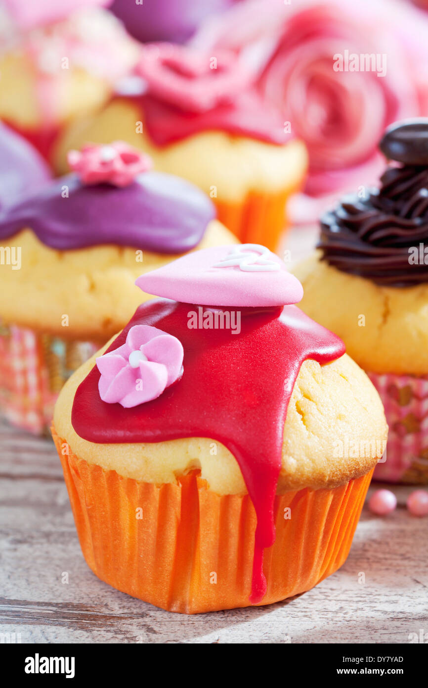 Decorated muffins in muffin papers Stock Photo - Alamy