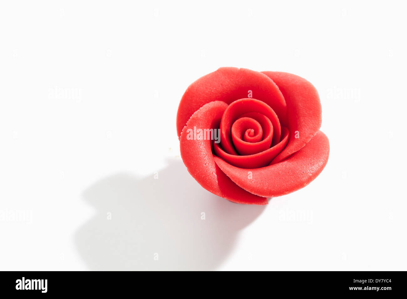 Red marzipan blossom on white background Stock Photo - Alamy