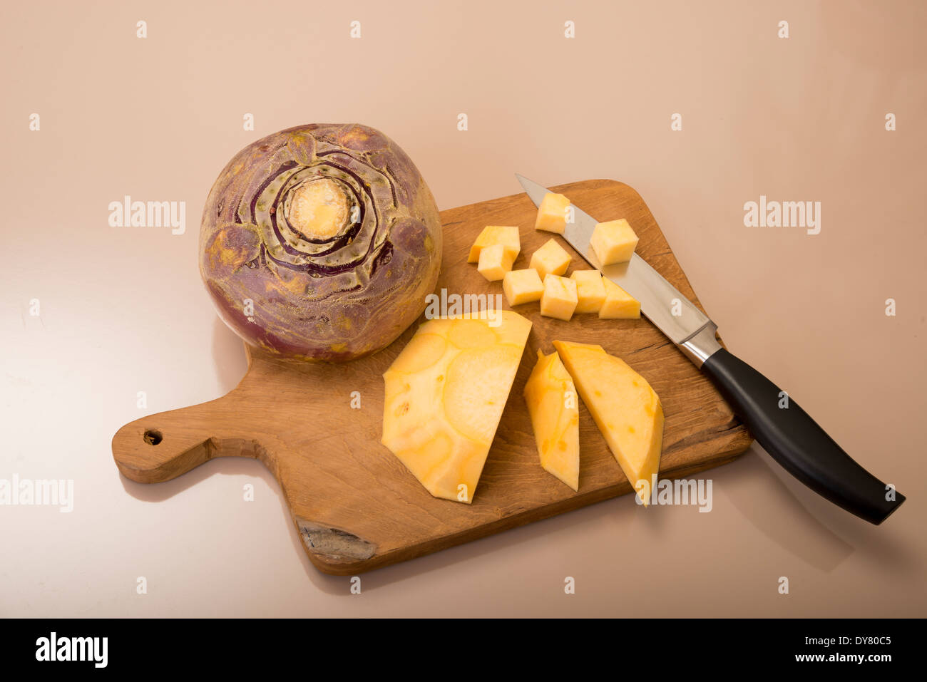 Chopped swede on chopping board Stock Photo - Alamy