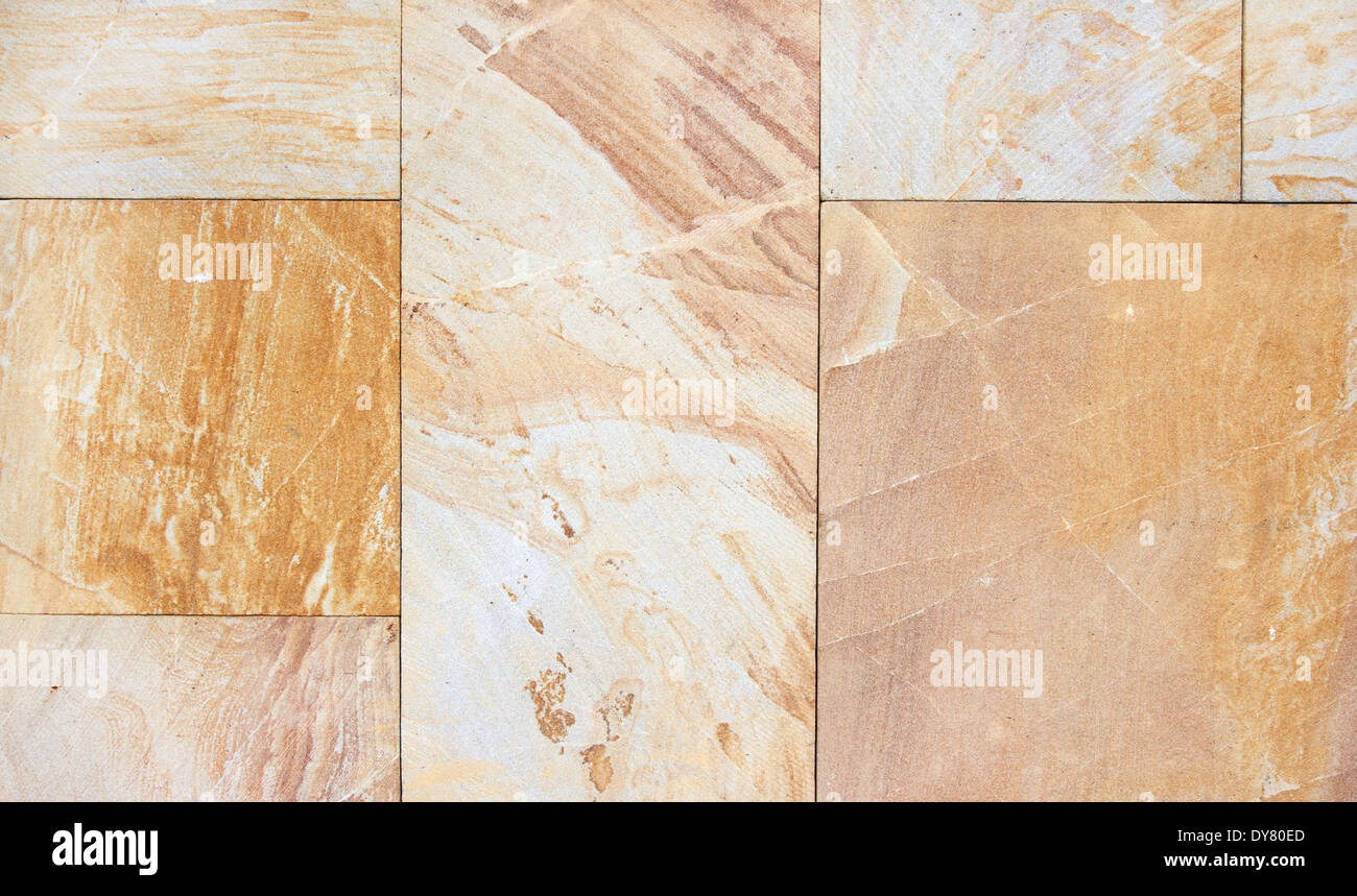 Wall from stone tiles with natural pattern. Stone tiles with natural ...