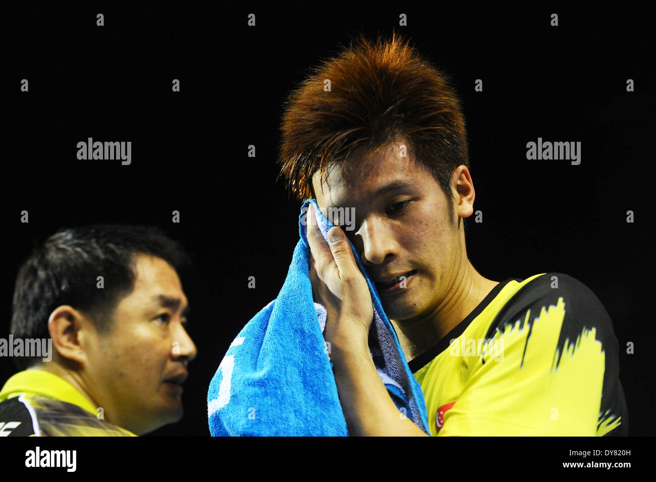 Singapore. 9th Apr, 2014. Derek Wong (R) of Singapore reacts during the ...