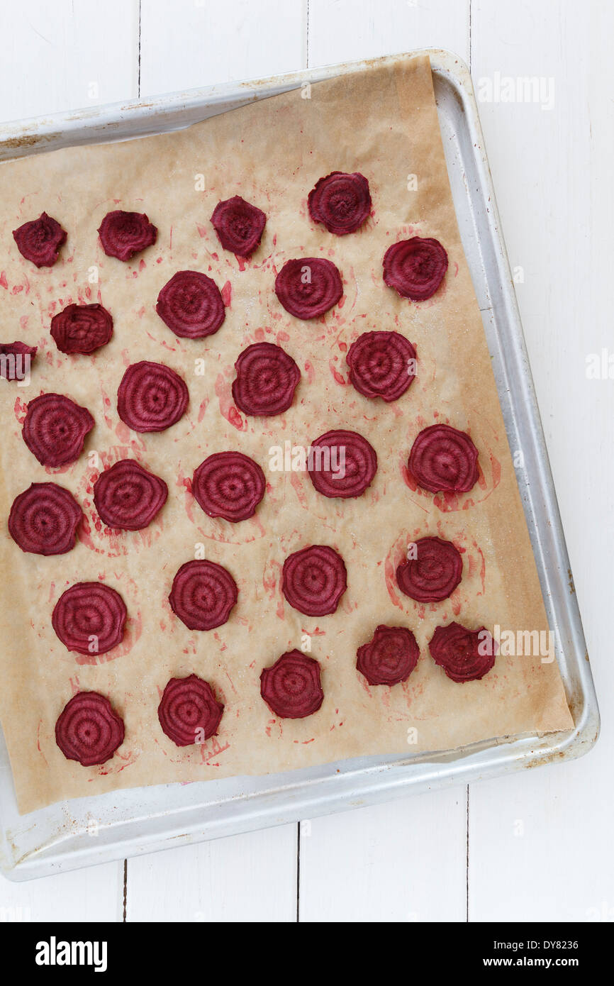 Baking tray with baked slices of beetroots, elevated view Stock Photo ...