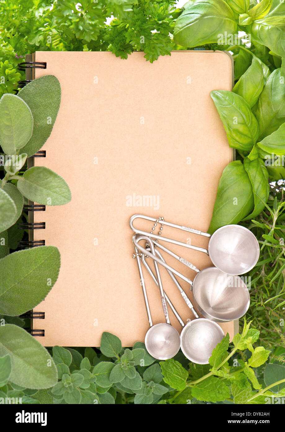 recipe book with variety fresh herbs. cooking background Stock Photo ...