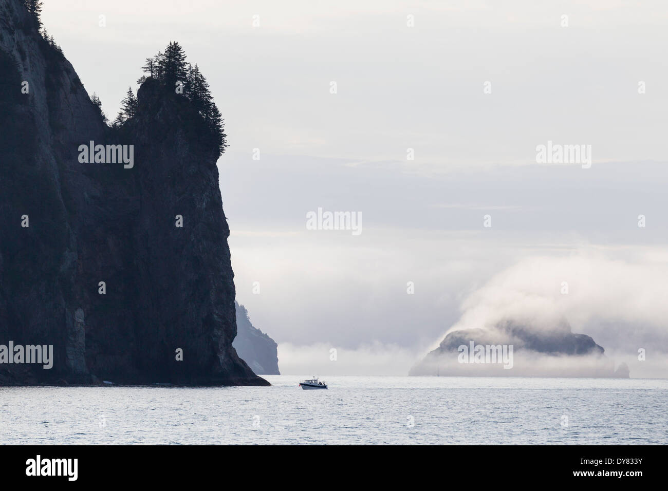 USA, Alaska, Seward, Resurrection Bay, view to rocks and sailing boat ...