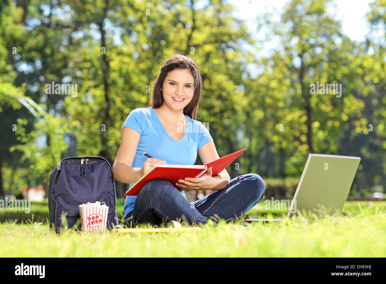Female student relaxing outdoors Stock Photo - Alamy