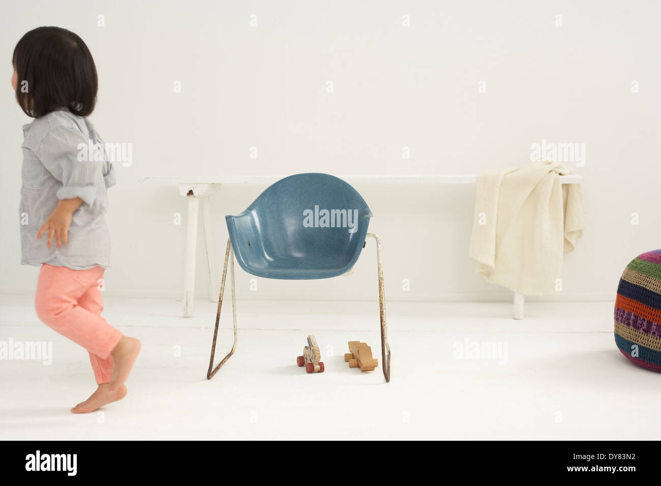 Little Asian girl leaving room Stock Photo - Alamy