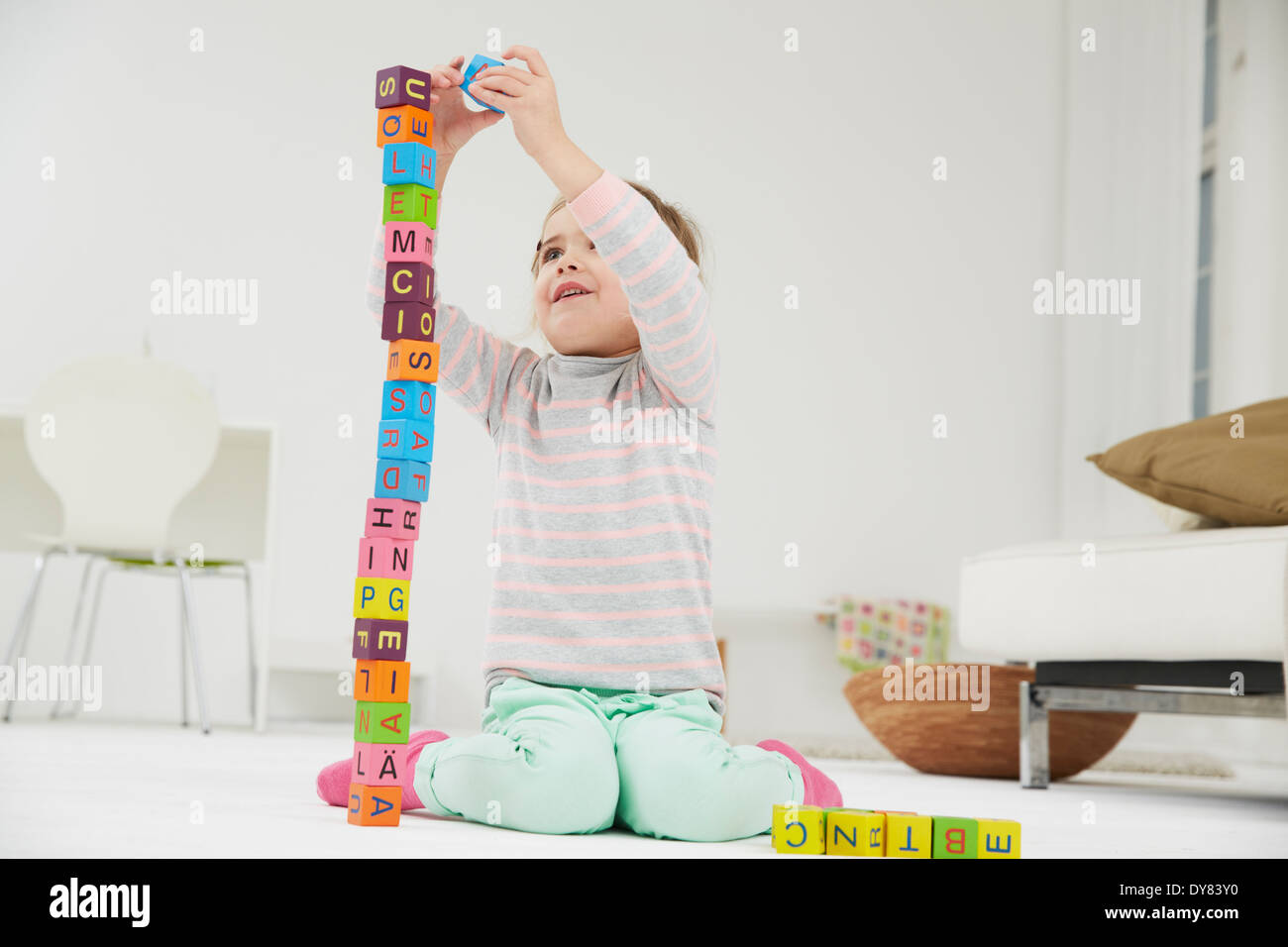 Child playing with letter blocks hi-res stock photography and images ...