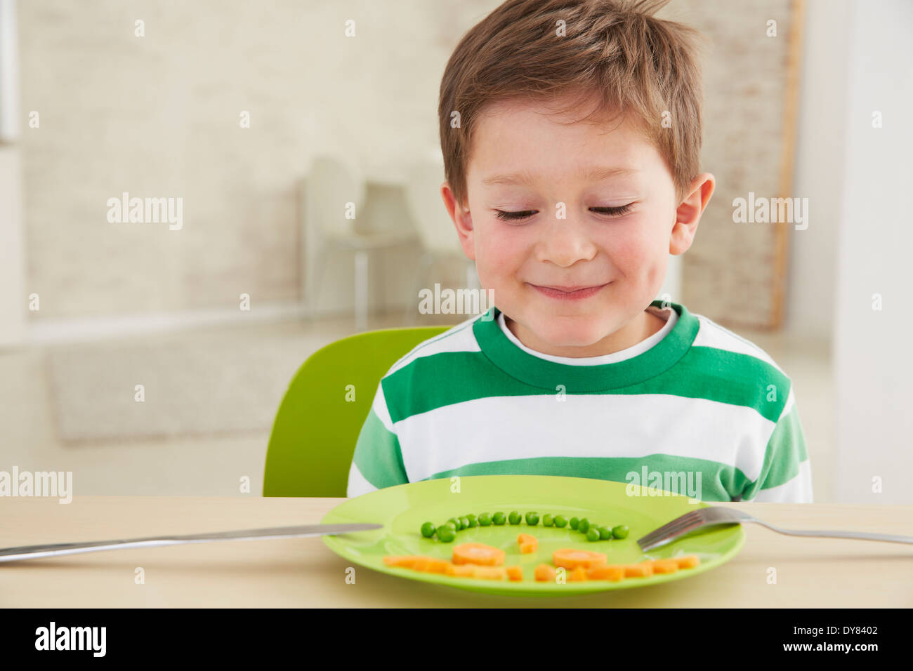 Boy Eating Peas And Carrots High Resolution Stock Photography and ...