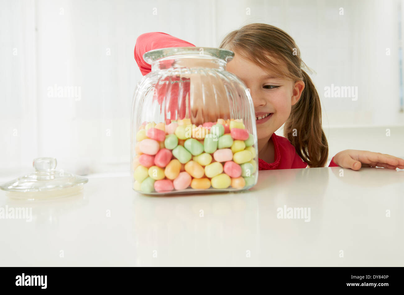 Girl candy jar hi-res stock photography and images - Alamy