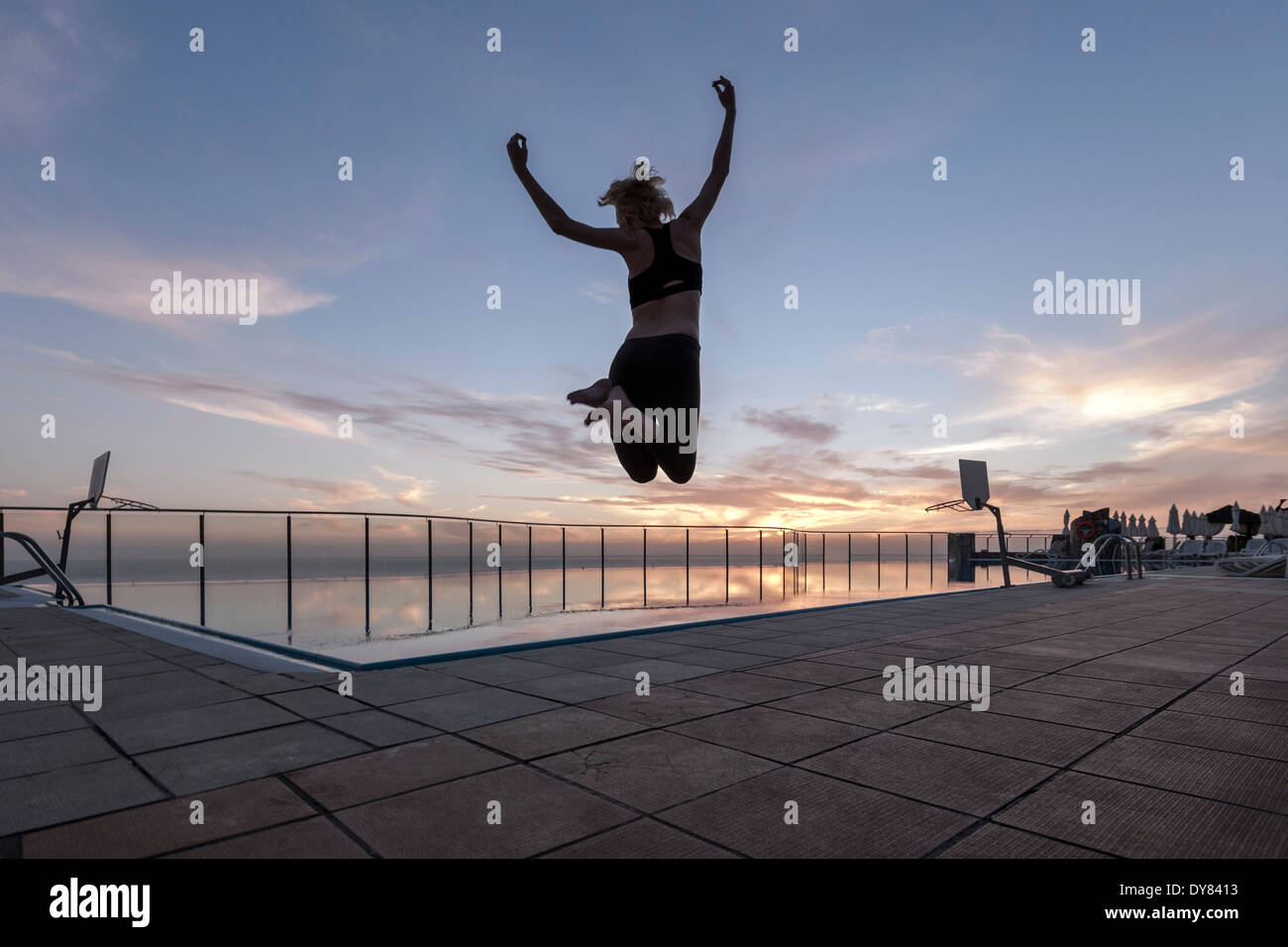 Women jumping pool hi-res stock photography and images - Alamy