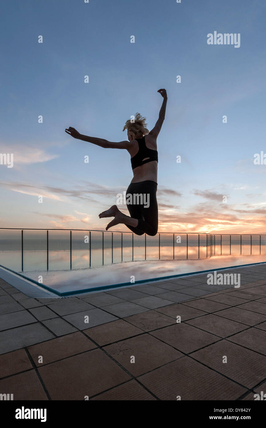 Women jumping pool hi-res stock photography and images - Alamy