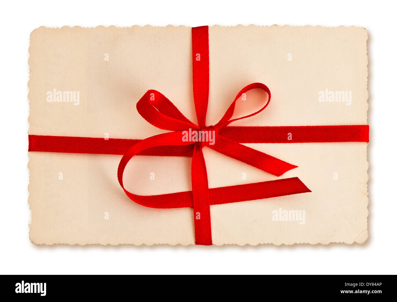 vintage gift card with red ribbon on white background with clipping ...