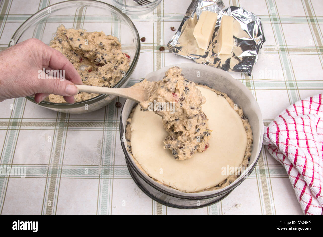 Simnel cake preparation, placing the remaining cake mixture on top of ...