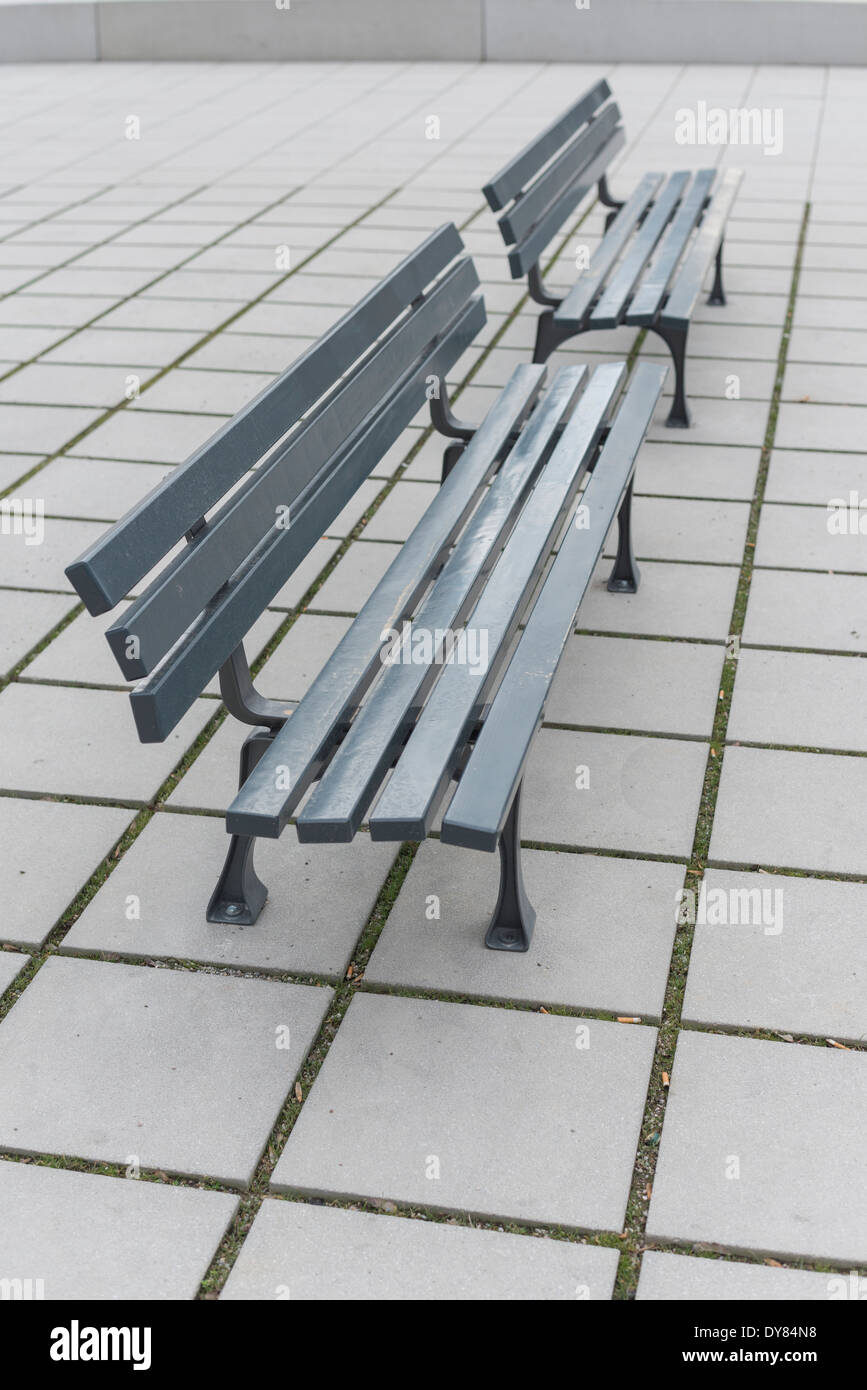 Two benches side by side in pedestrian area Stock Photo - Alamy
