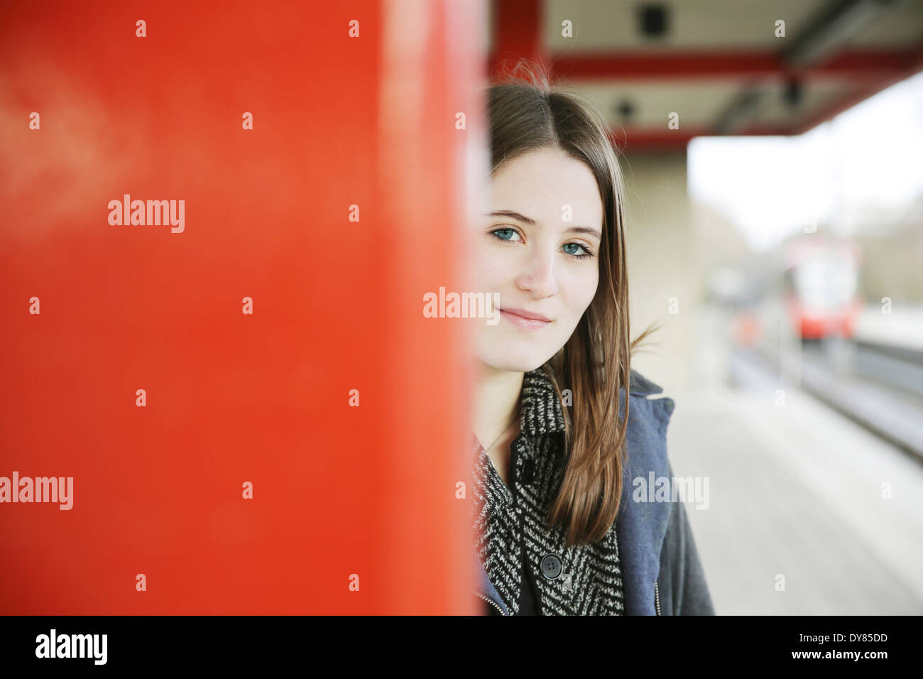 Portrait of teenage girl waiting on platform Stock Photo - Alamy
